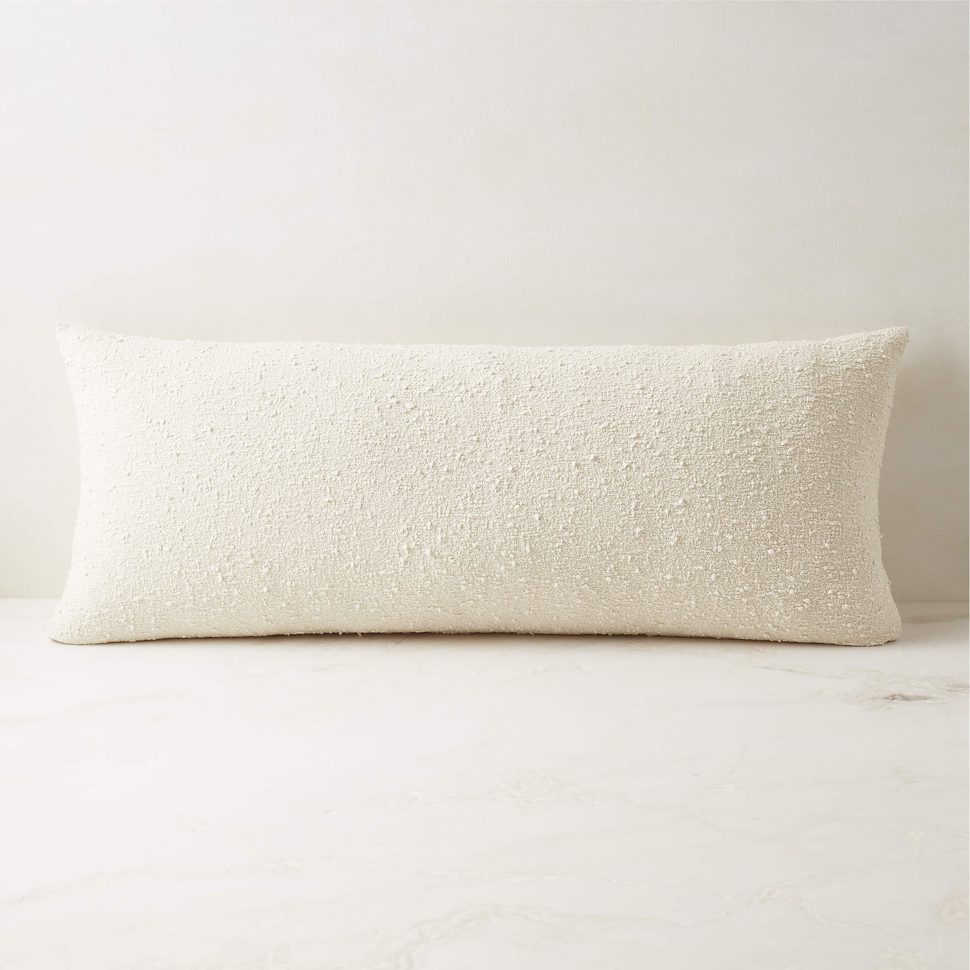Ivory Boucle Throw Pillow with Down-Alternative Insert 36"x16" - CB2 | Havenly